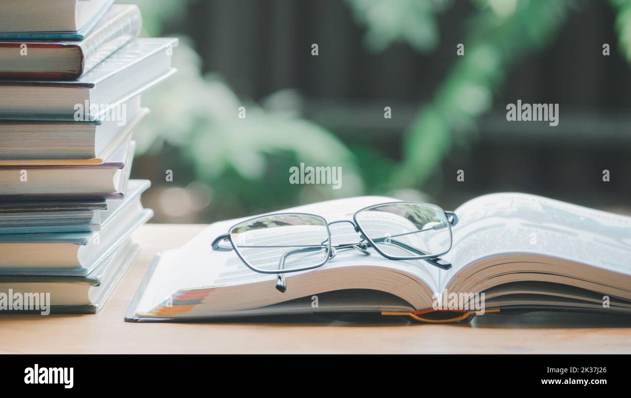 A simple composition of many books, stack or pile of books on wooden ...