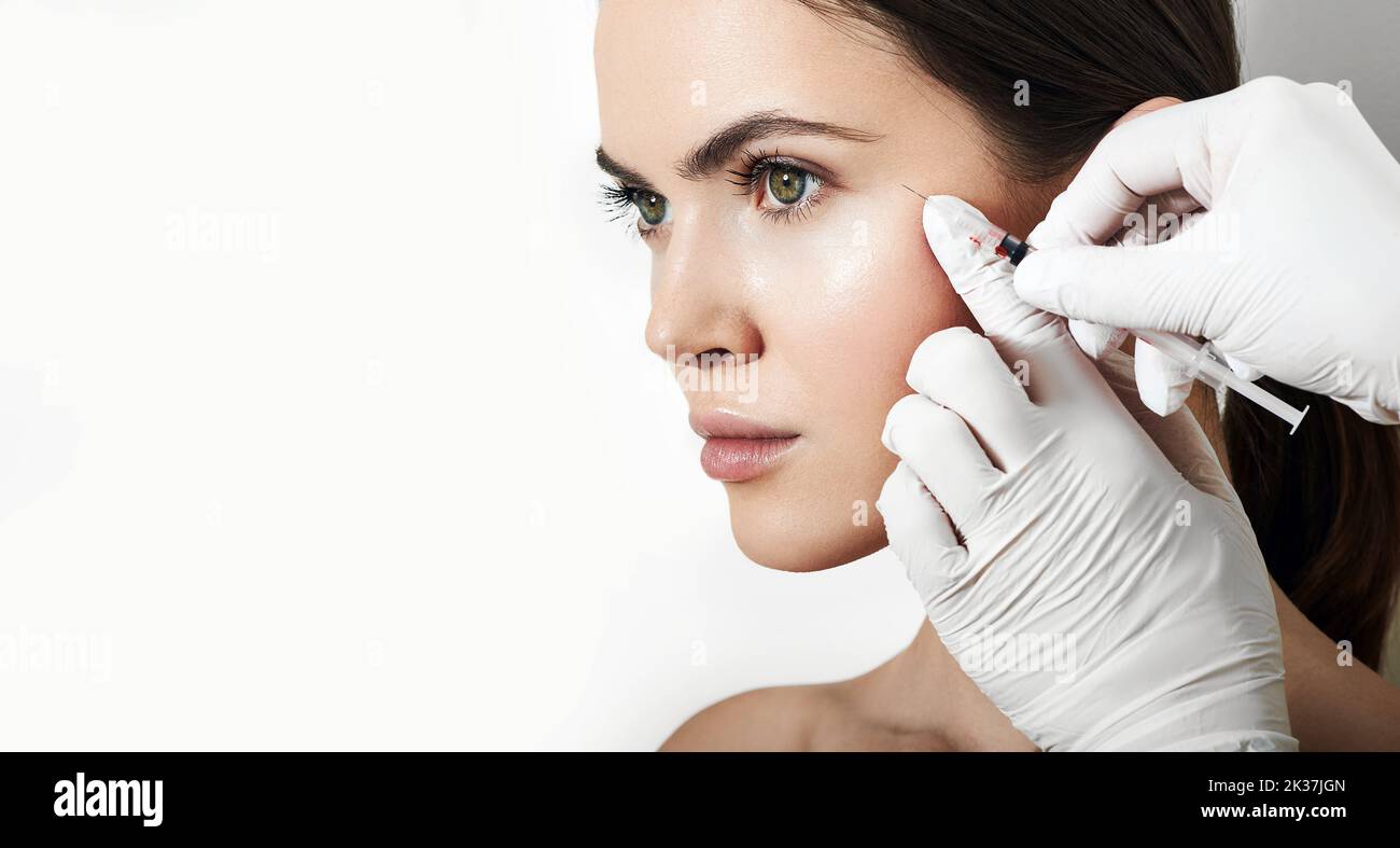 Beautiful woman during facial mesotherapy for smoothing of mimic ...