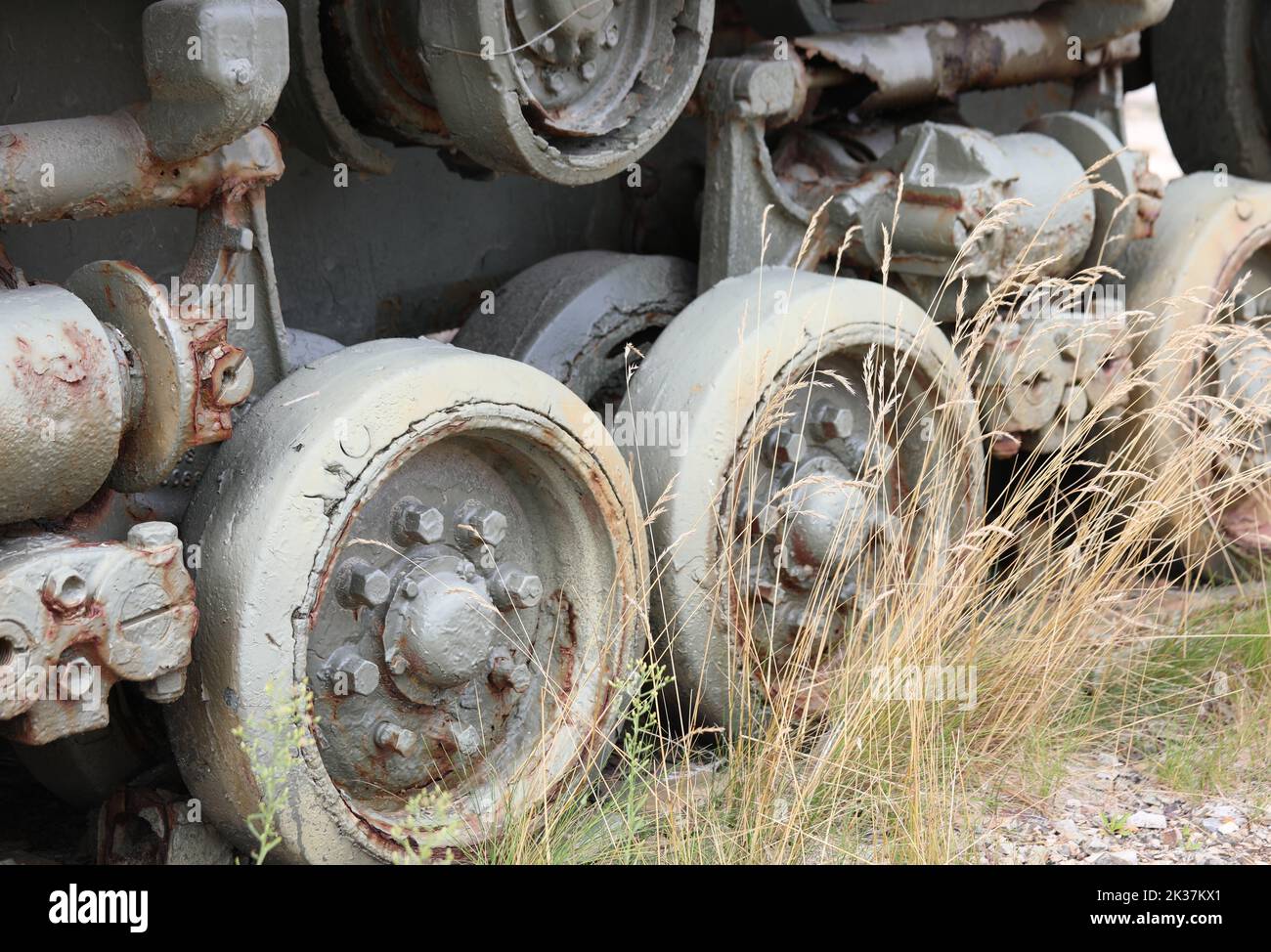 details of the wheels of an abandoned tank after the battle in the war ...