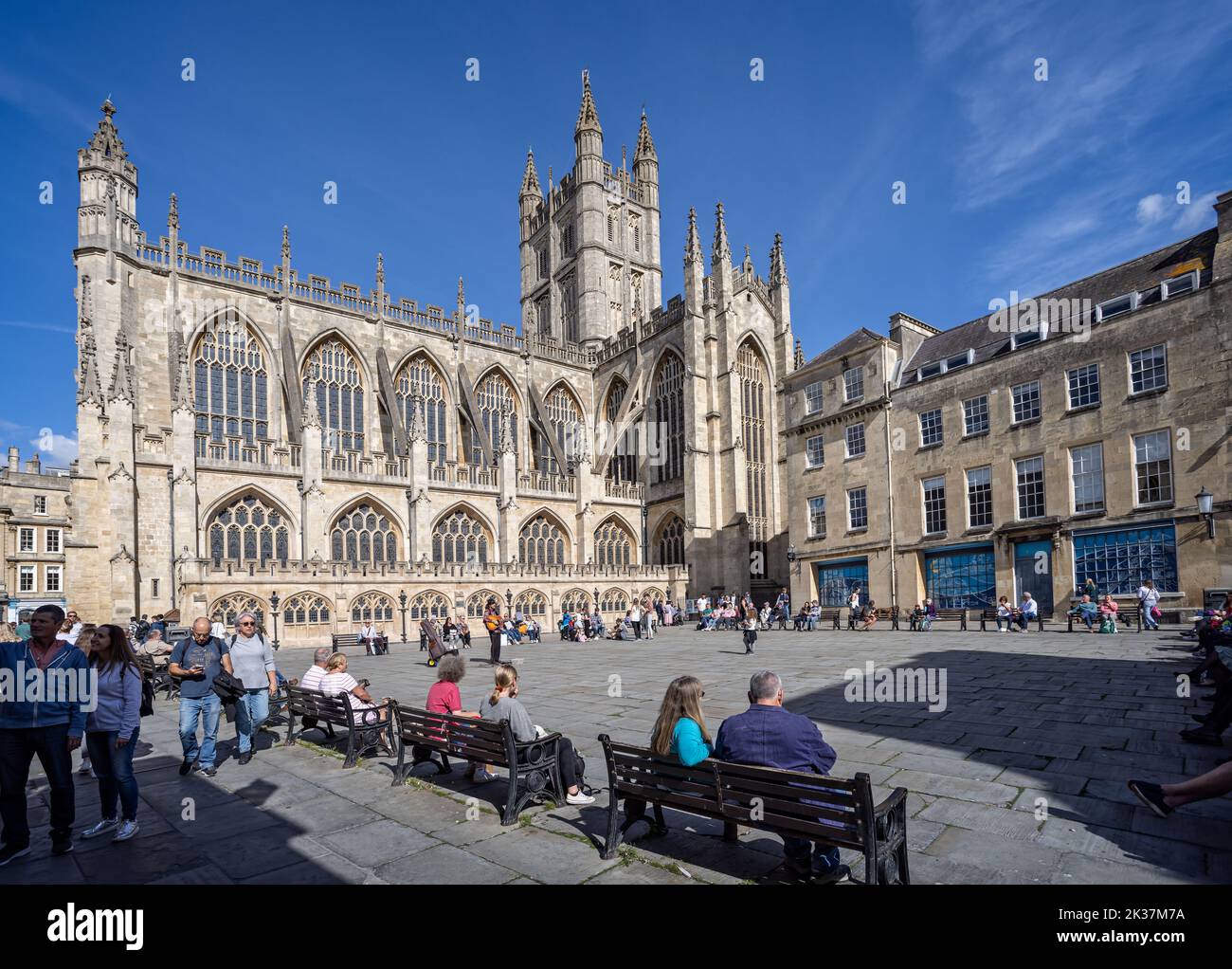 Bath Abbey and Kingston Parade with busker performing in Bath, Avon, UK ...