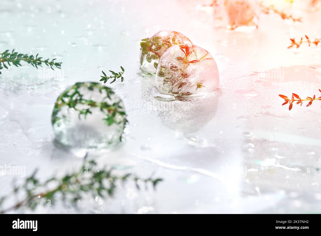 Wet off white water background with melting balls of ice with frozen ...