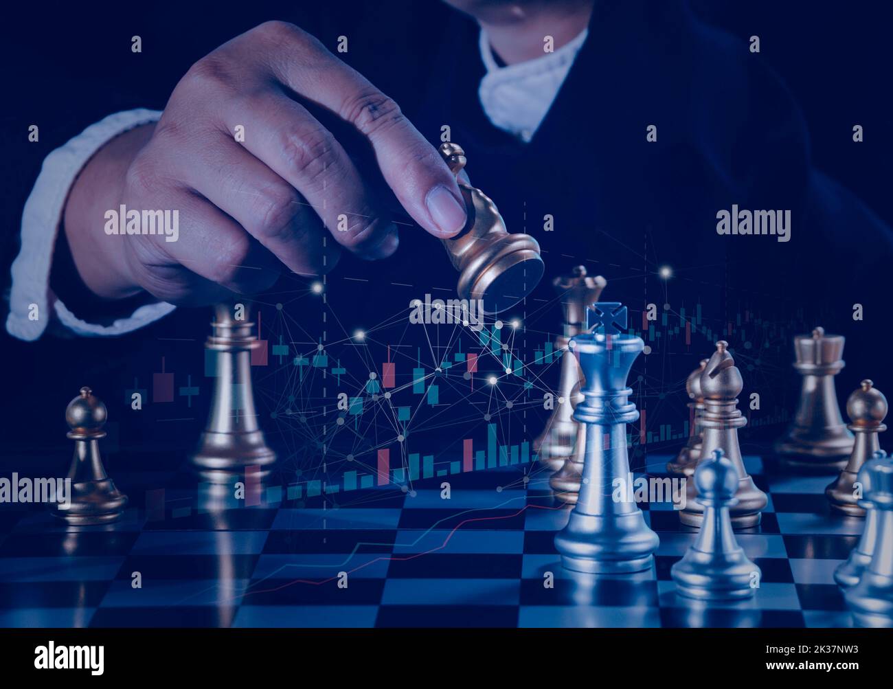 Hand of businessman holding gold king chess on stock market or forex ...