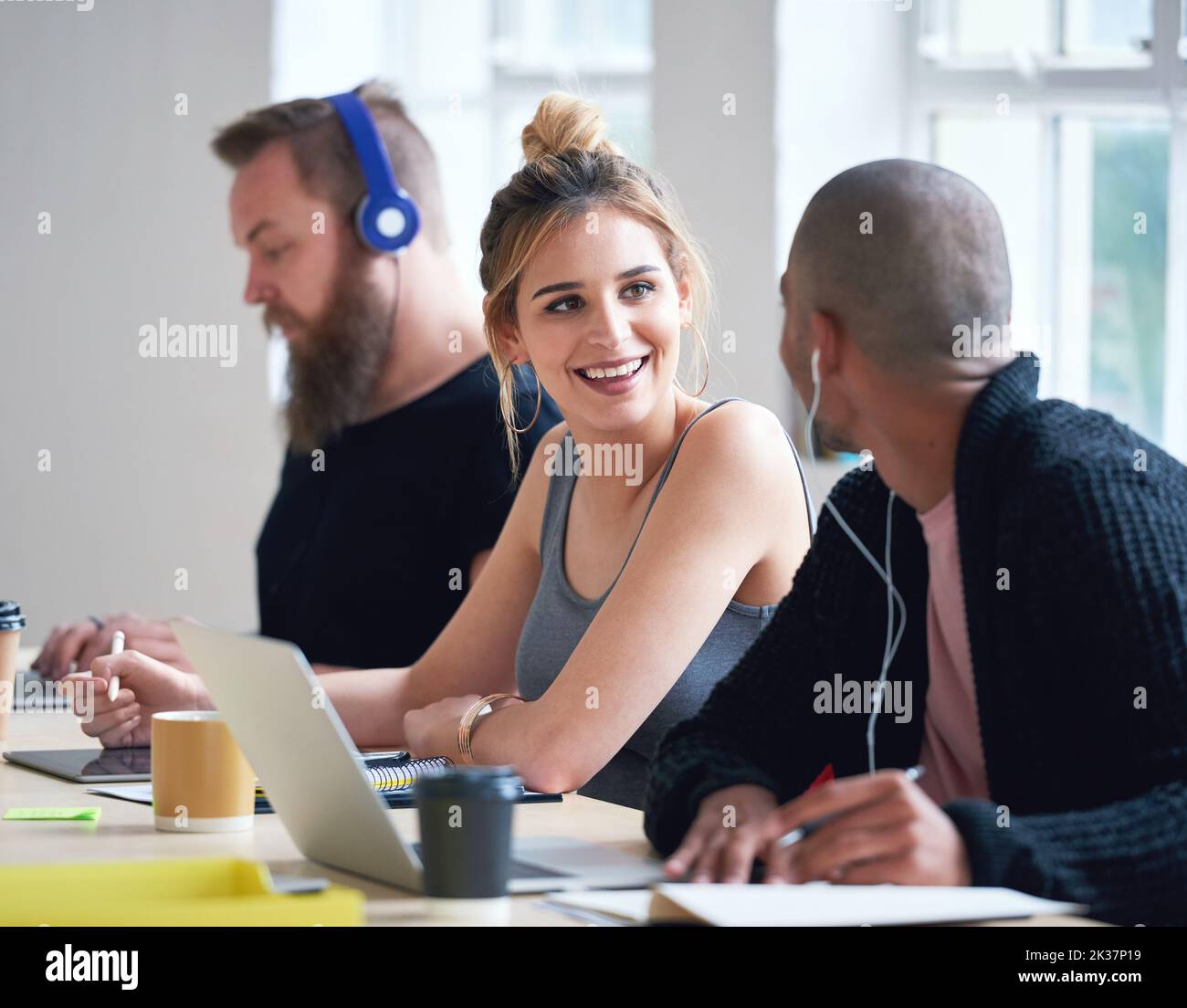 College students in class young woman discussing group project with ...