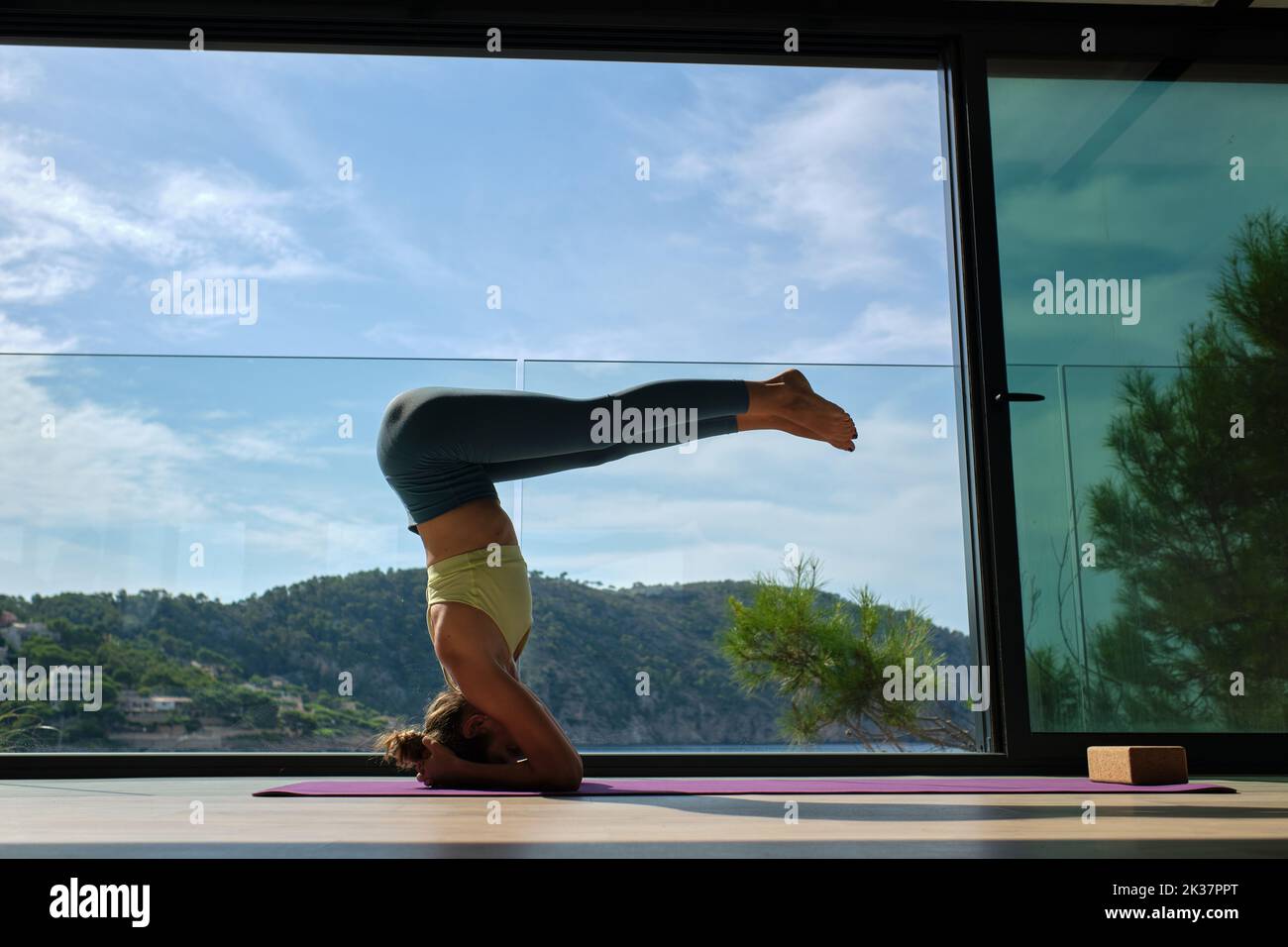 Side headstand pose hi-res stock photography and images - Alamy