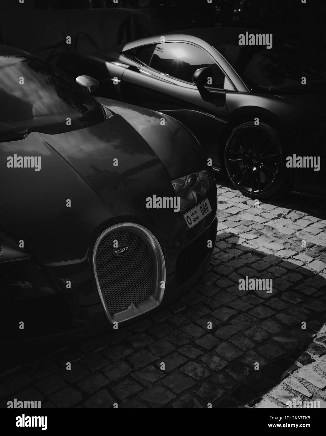 Greyscale black luxury car bugatti on the streets of Cannes in France ...