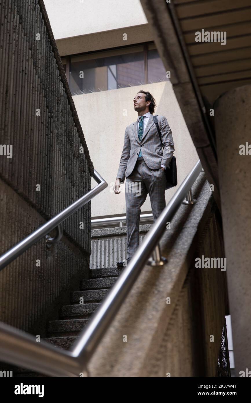 Man standing at top of stairs hi-res stock photography and images - Alamy