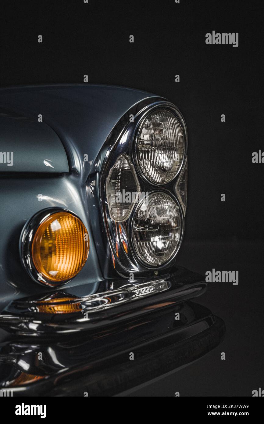 a vertical shot of the headlights of a classical car Stock Photo - Alamy