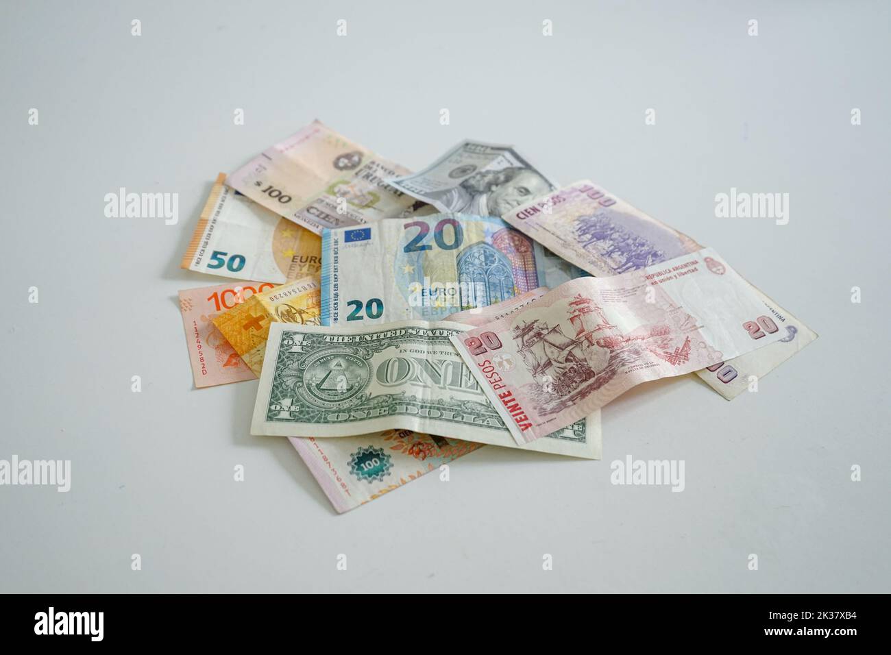 Banknotes from different currencies on white background Stock Photo - Alamy