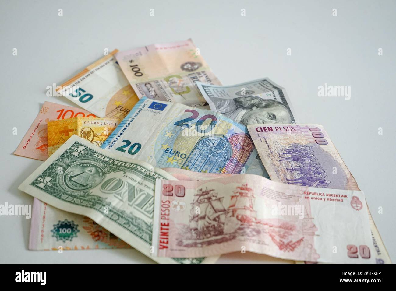 Banknotes from different currencies on white background Stock Photo - Alamy