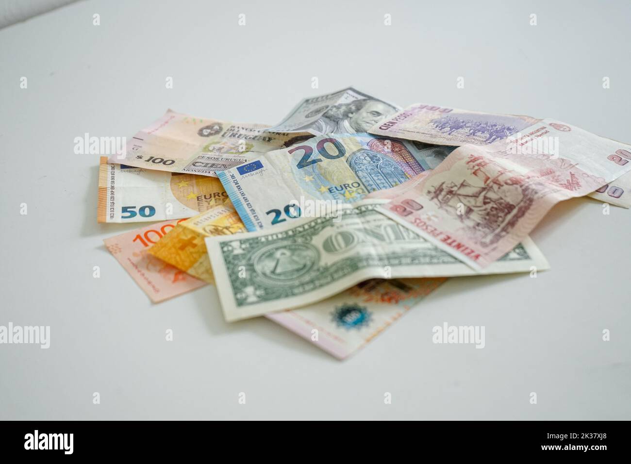 Banknotes from different currencies on white background Stock Photo - Alamy