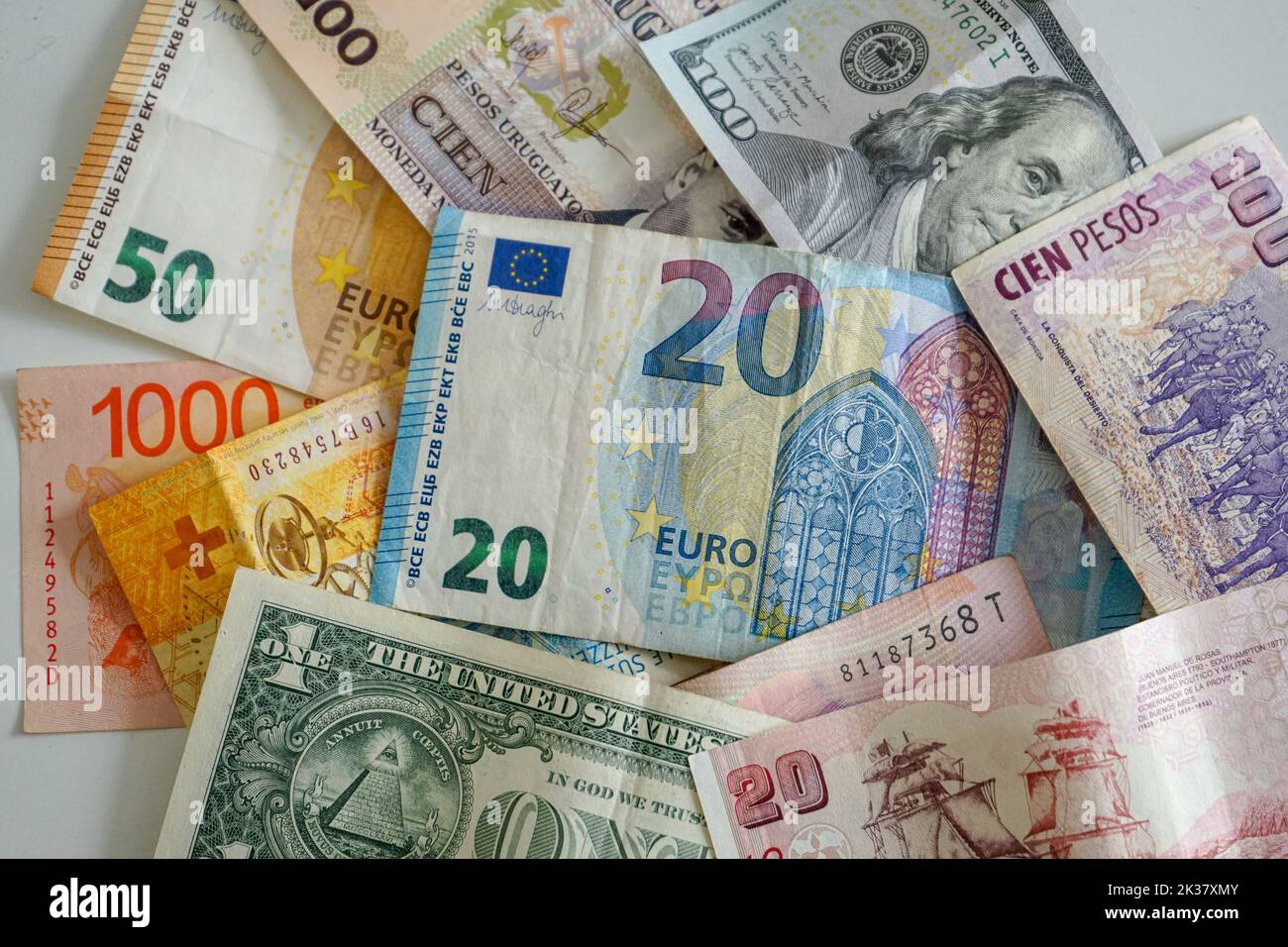 Banknotes from different currencies on white background Stock Photo - Alamy