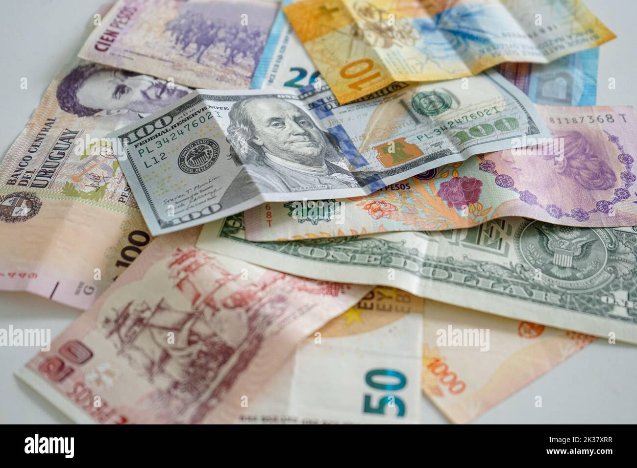 Banknotes from different currencies on white background Stock Photo - Alamy