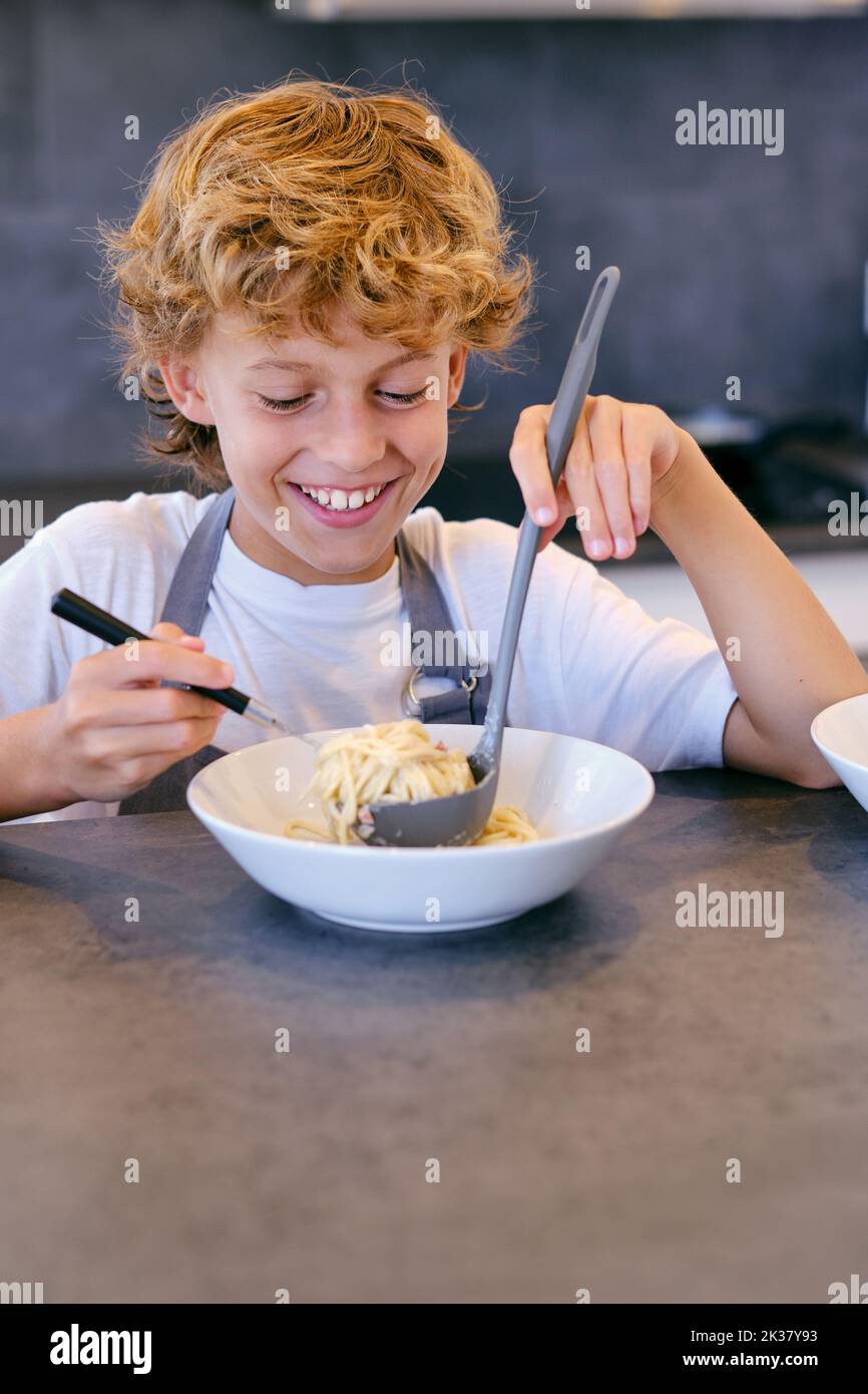 Boy spaghetti bowl hi-res stock photography and images - Alamy
