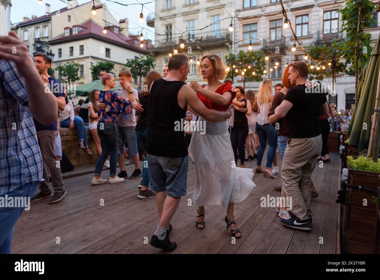 Lviv, Ukraine - June 9, 2018: Salsa dancers in outdoor cafe near Diana ...