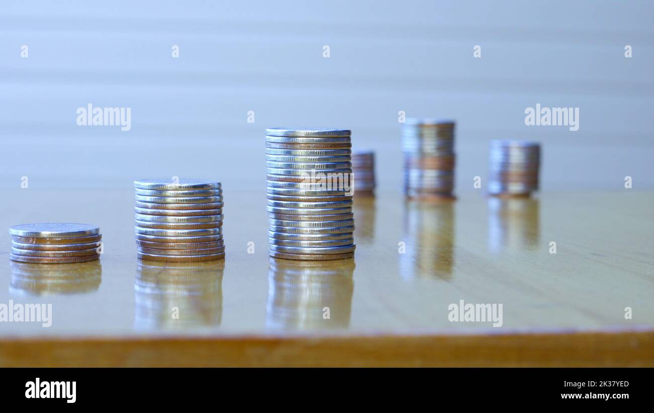 Coin stacks on a white background. Growth money of profitability of ...