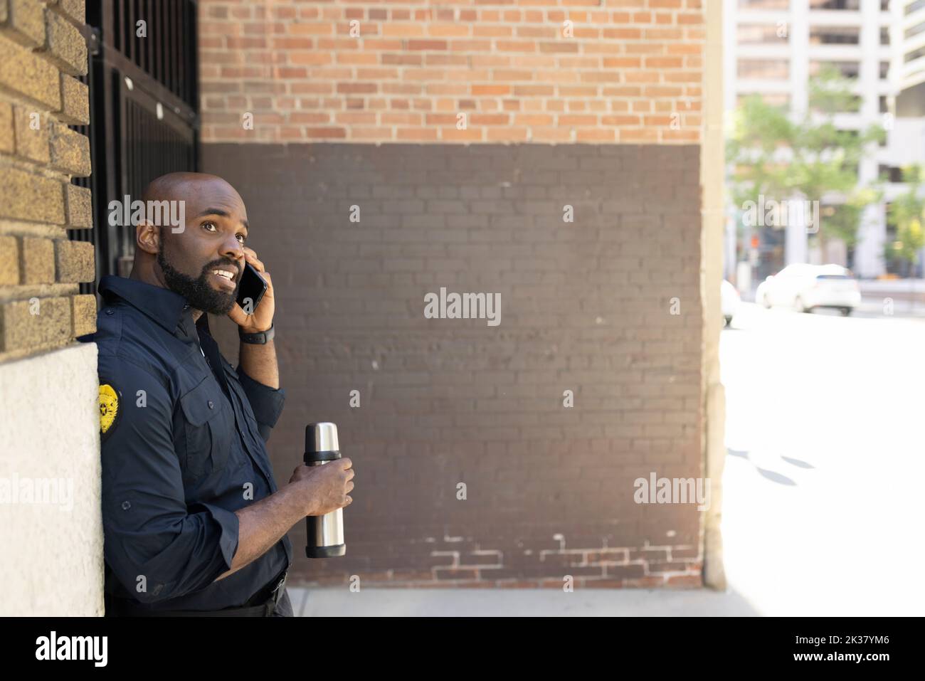 Security guard holding flask hi-res stock photography and images - Alamy