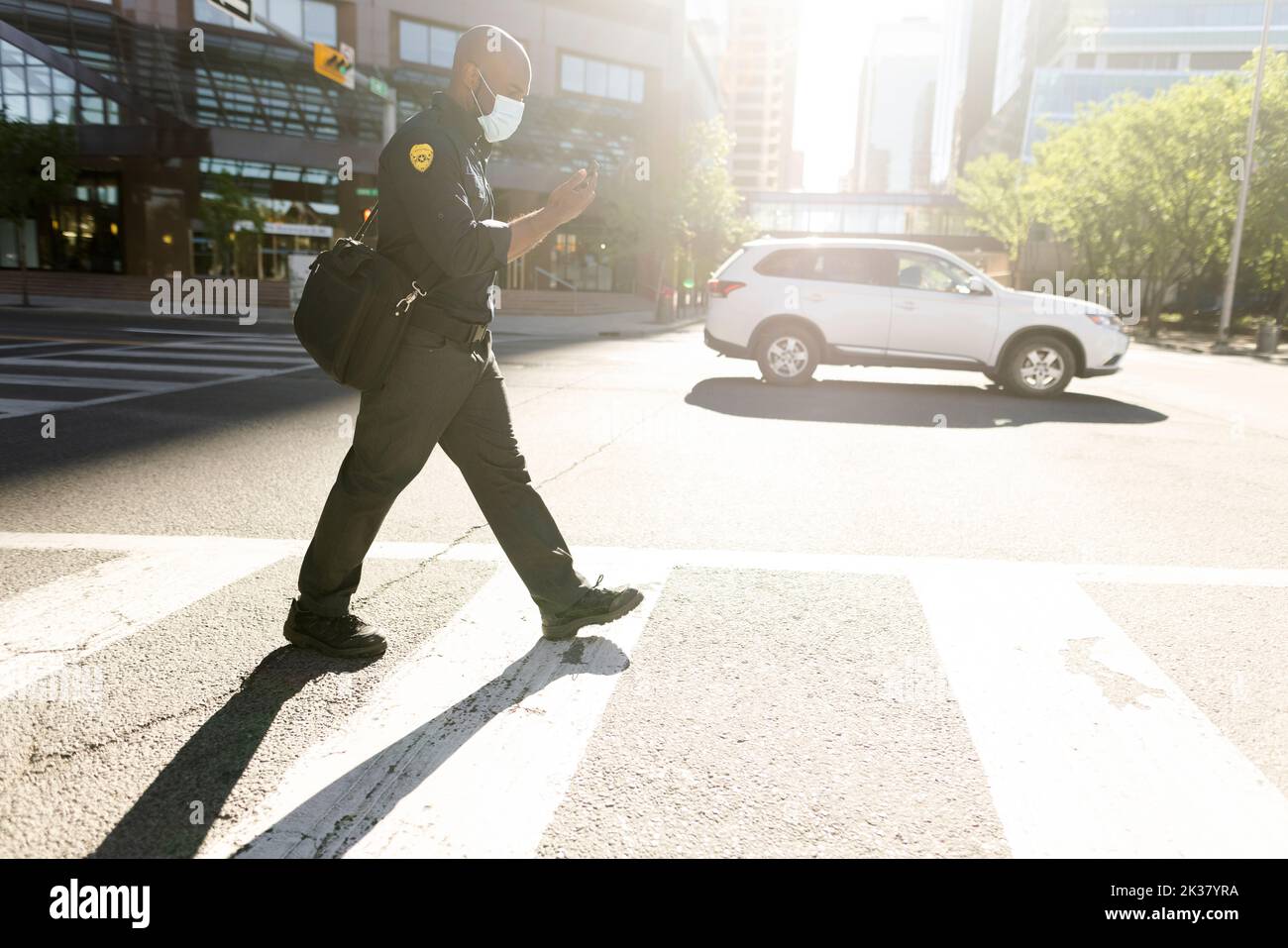 Face mask wearing security guard hi-res stock photography and images ...