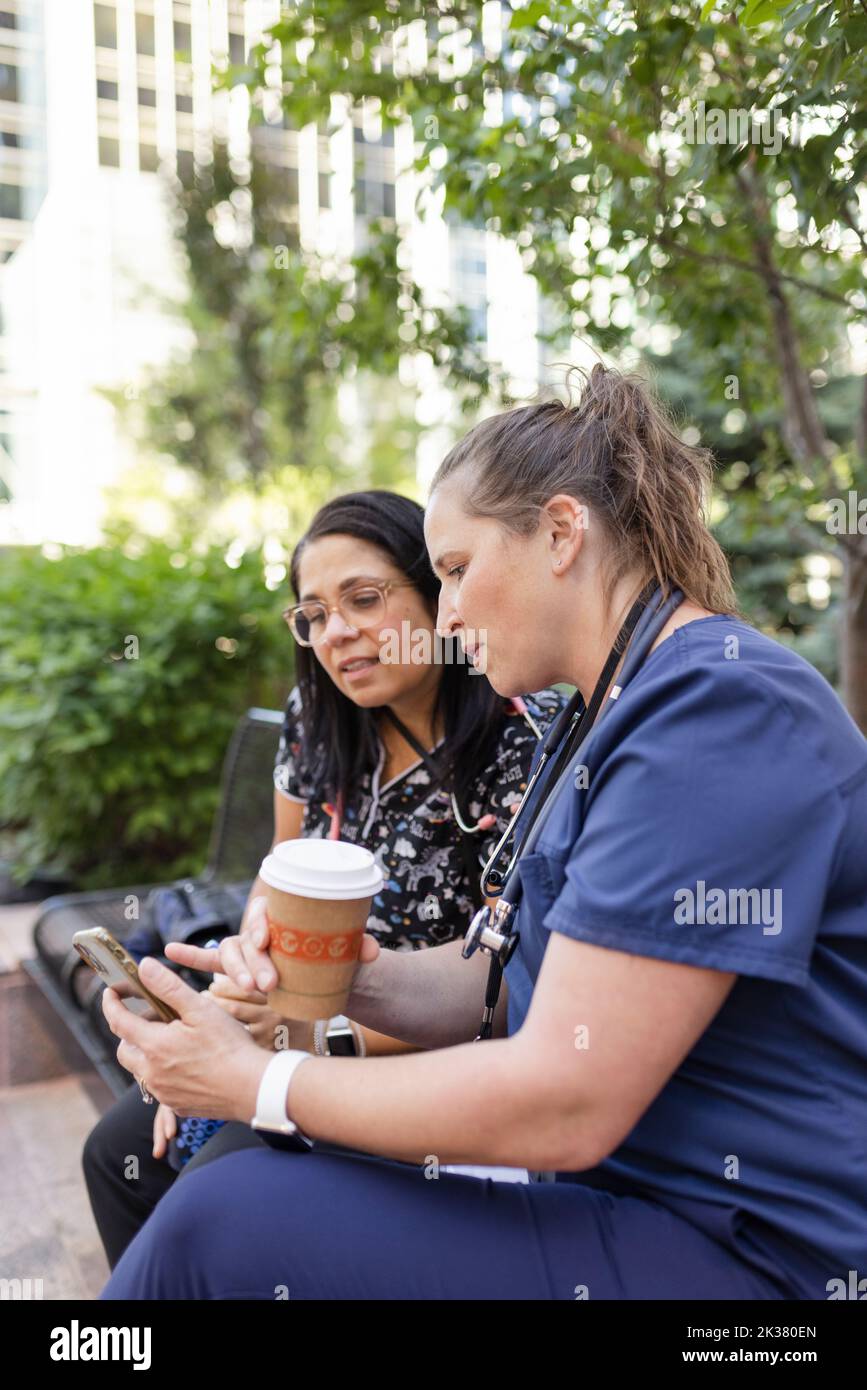 Community health workers with phone hi-res stock photography and images ...