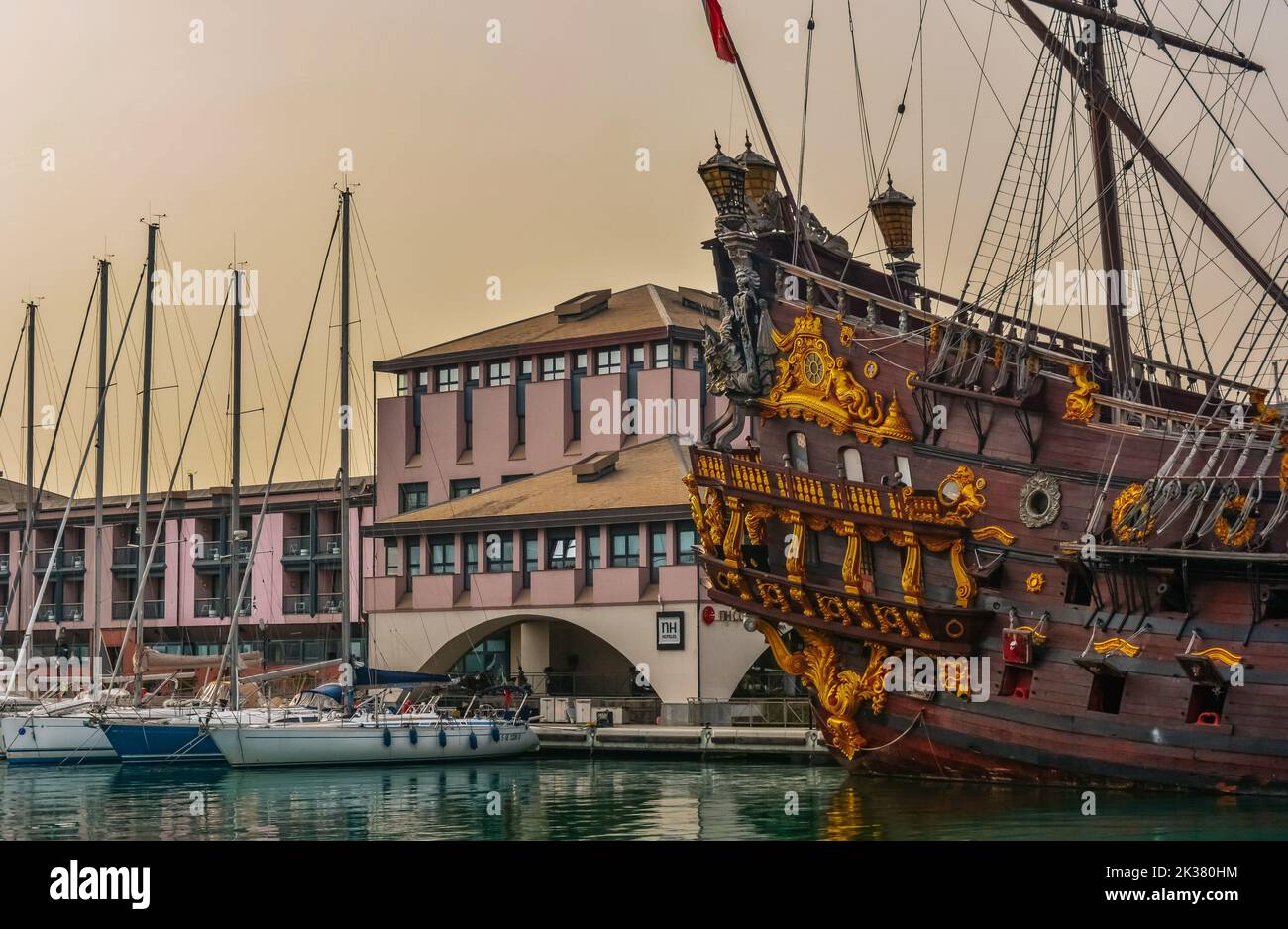 The port of Genoa during the sunset Stock Photo - Alamy