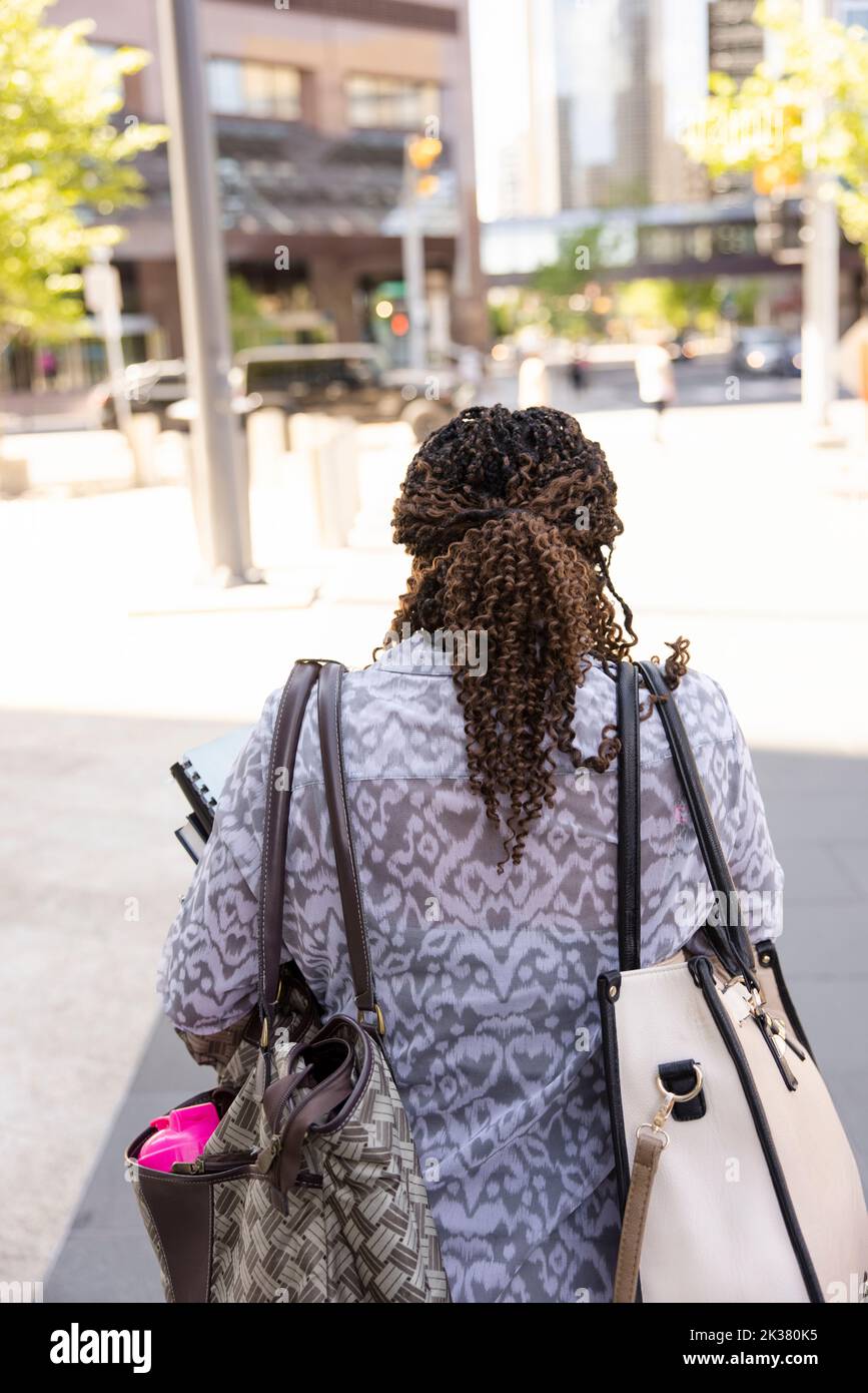 Rear view of civil worker walking on sidewalk Stock Photo - Alamy
