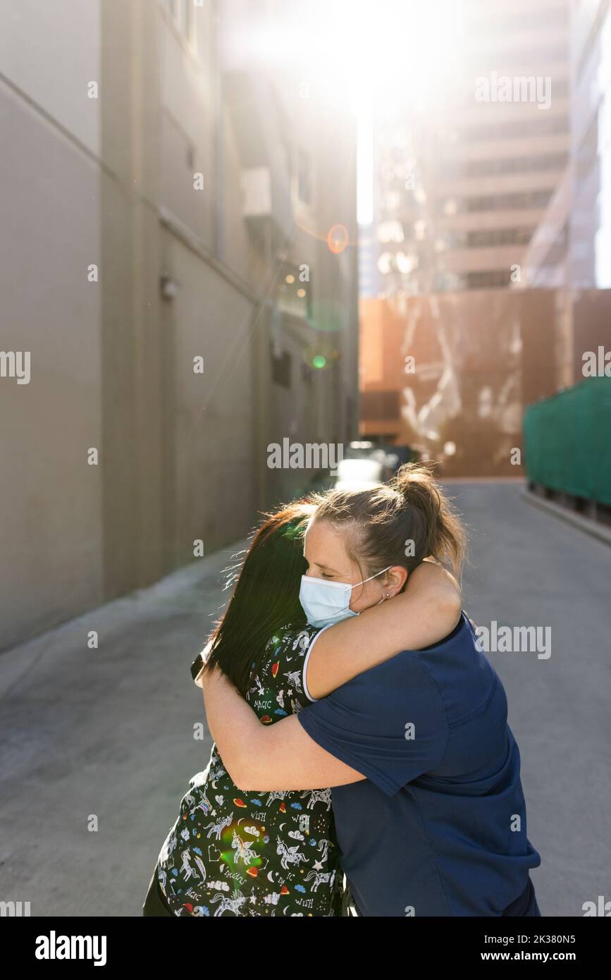 Hug colleague hi-res stock photography and images - Alamy