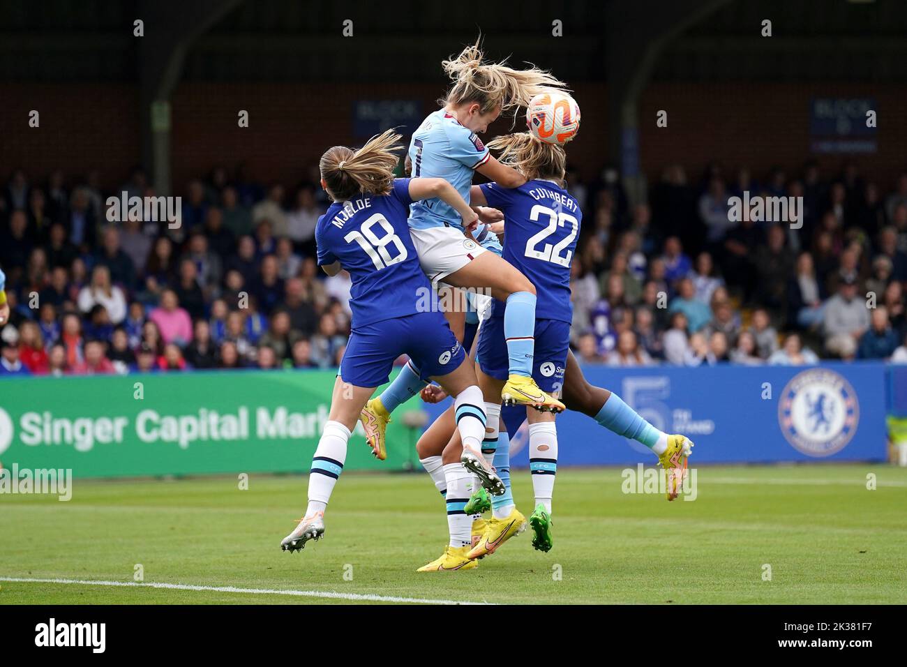 Manchester City's Lauren Hemp (centre) battles for the ball with ...