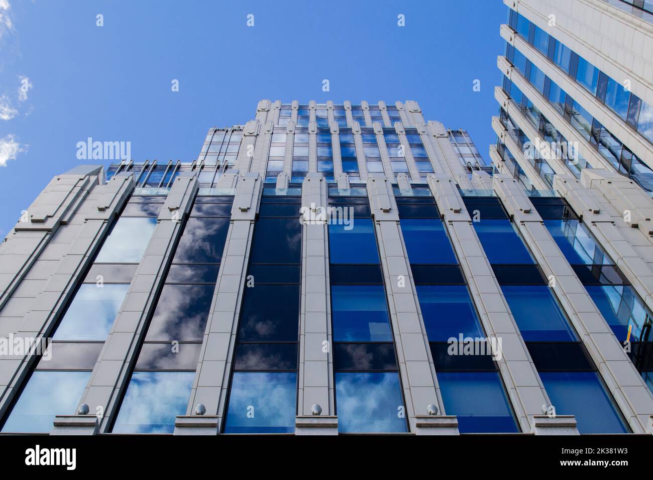 Moscow, Russia, June 2020: The blue sky with clouds is reflected in the ...