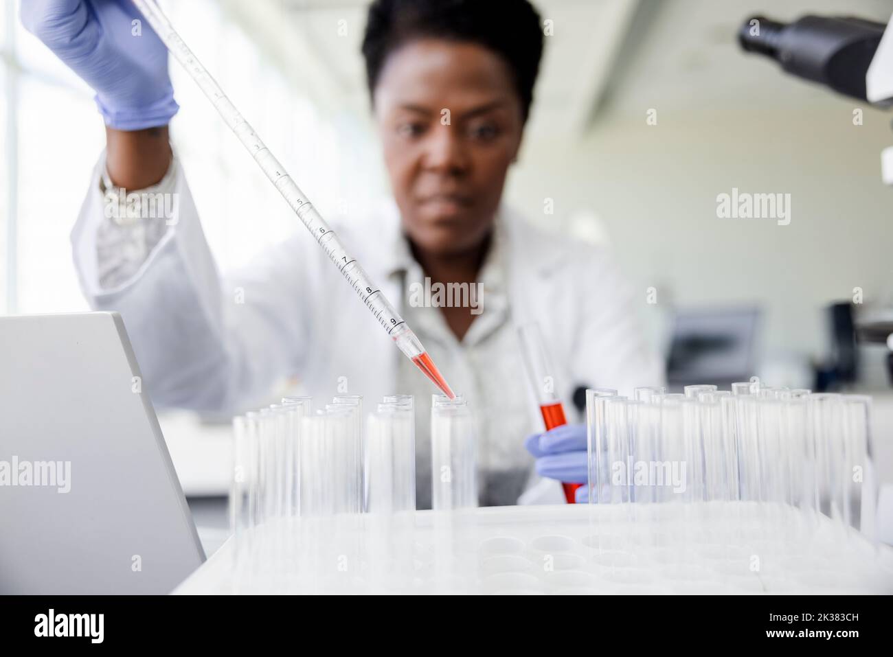 Scientist holding pipette hi-res stock photography and images - Alamy