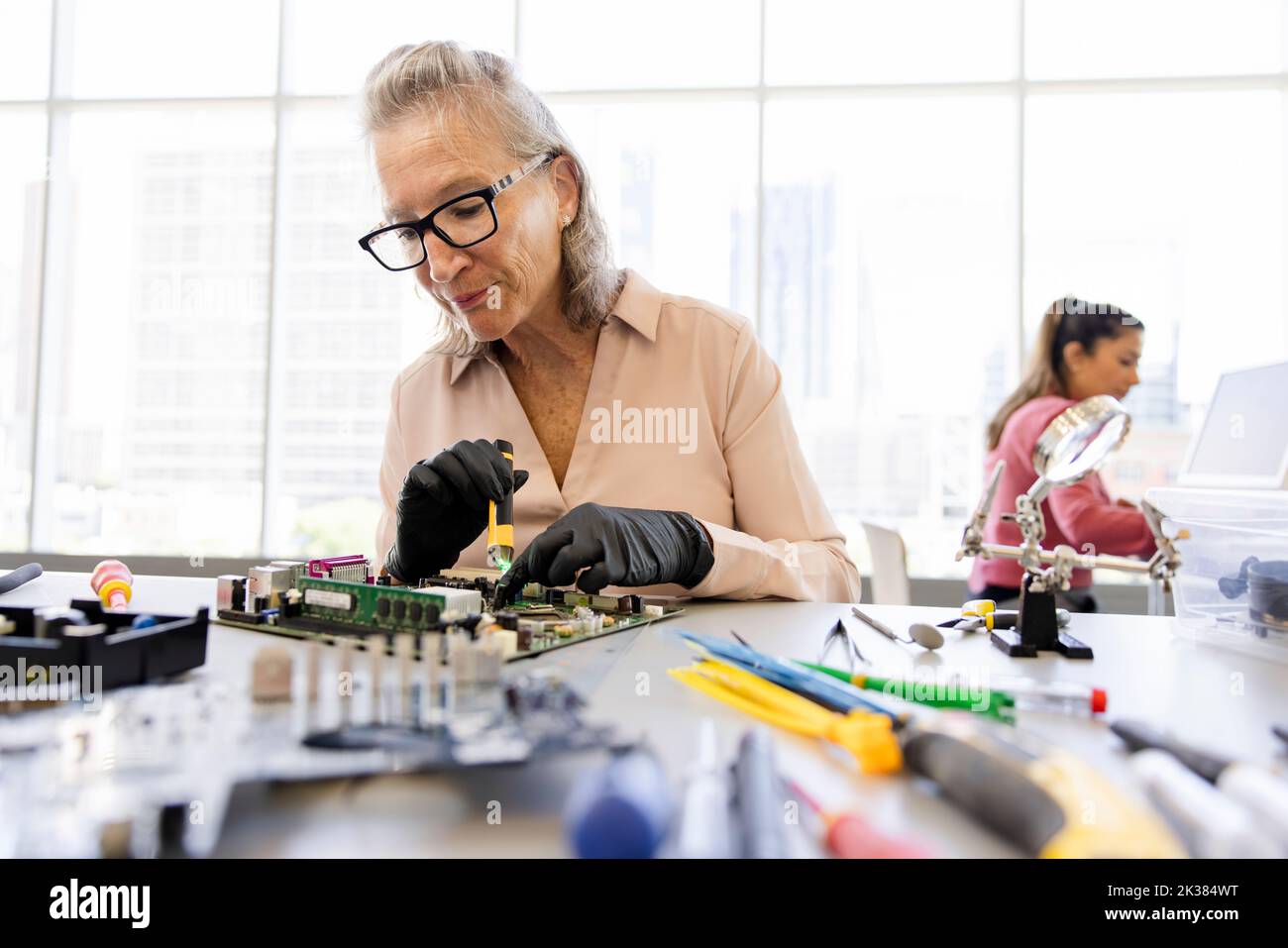 Female holding circuit board hi-res stock photography and images - Alamy