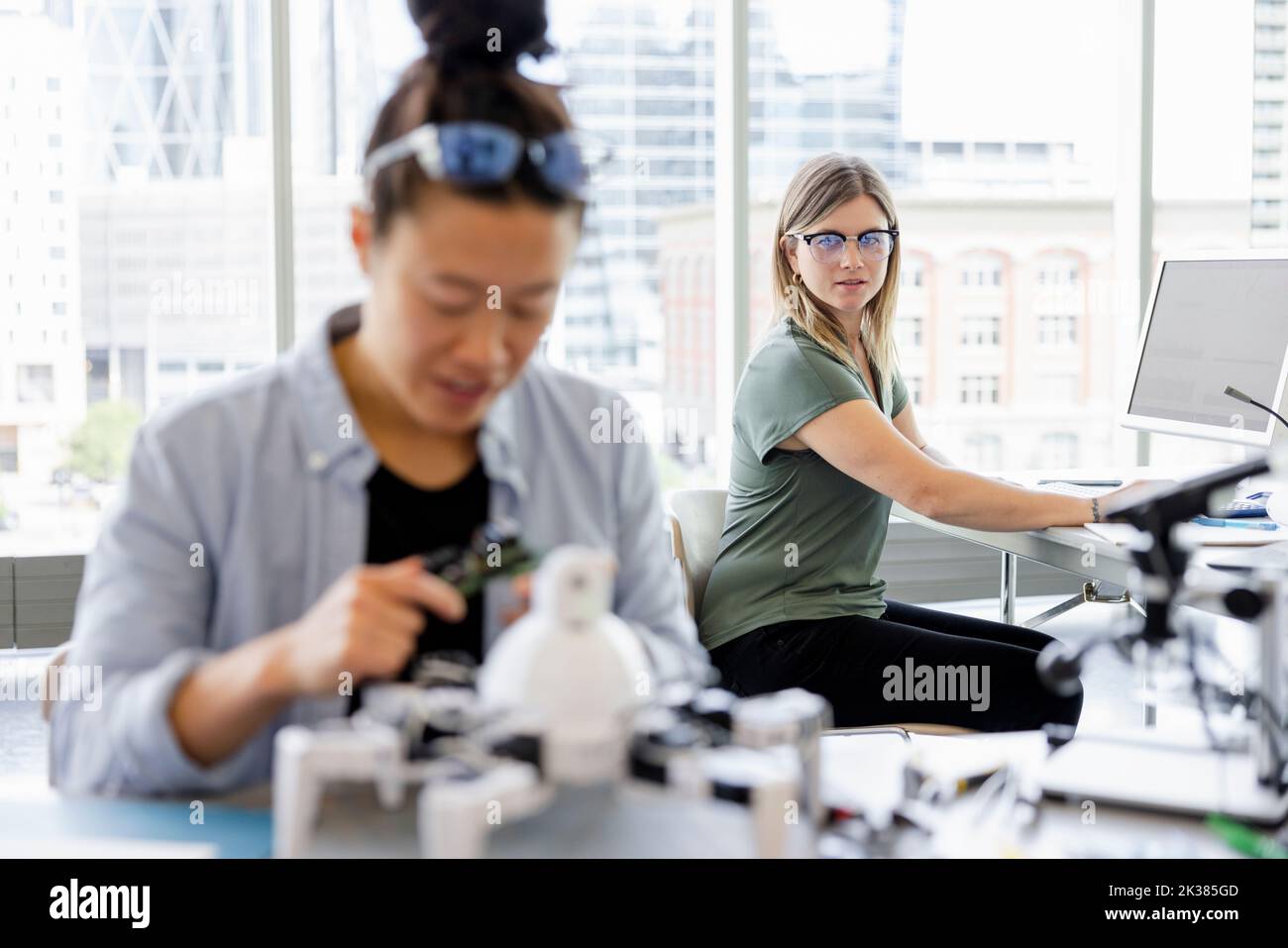 Two engineers looking at computer hi-res stock photography and images ...