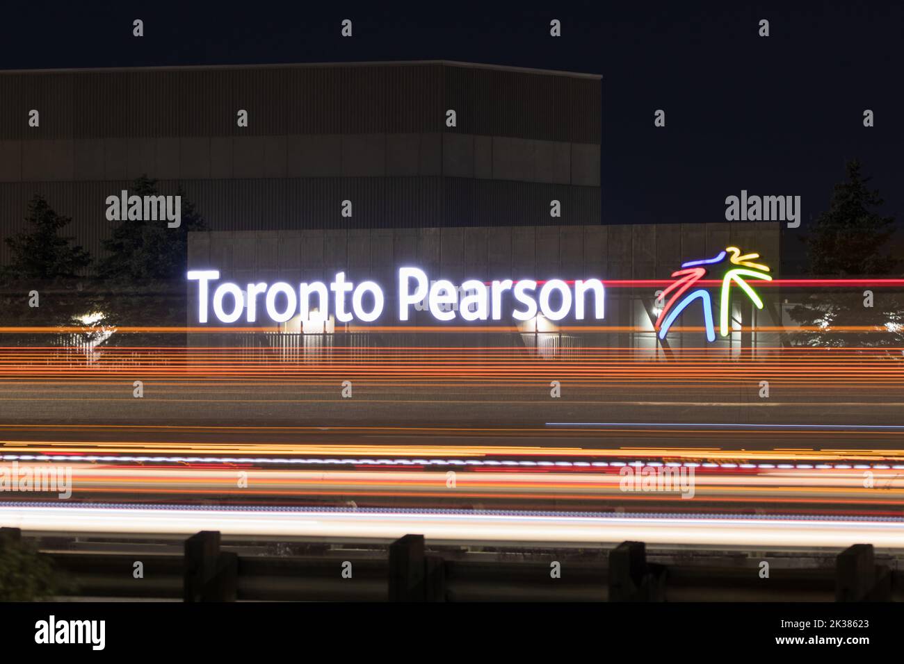 The Toronto Pearson Intl. Airport logo is seen beside a busy highway ...