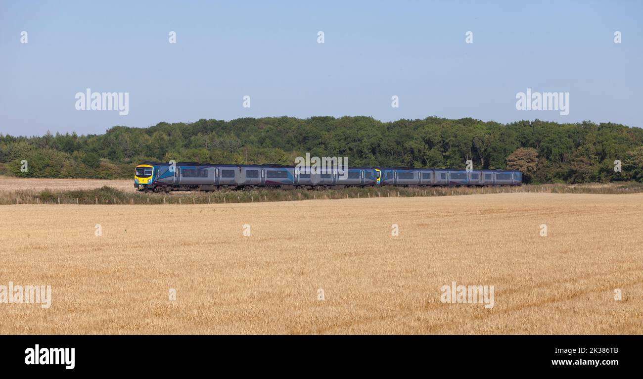 2 First Transpennine Express class 185 trains passing the arable fields ...