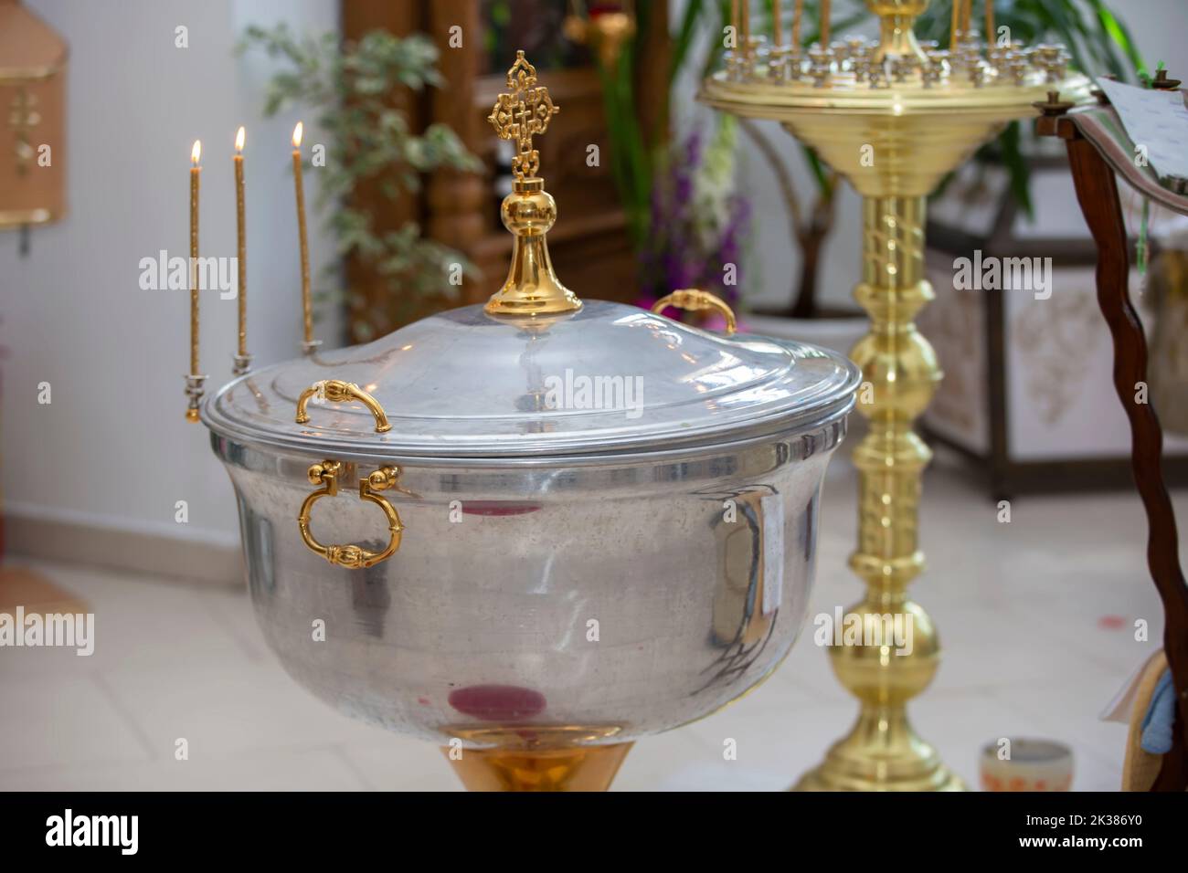 Bowl for Orthodox baptism of children in the temple Stock Photo - Alamy
