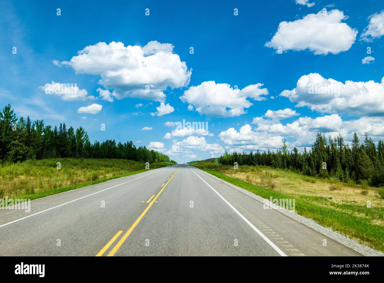 Lone camper travels the Alaska Highway near Prophet River on a ...