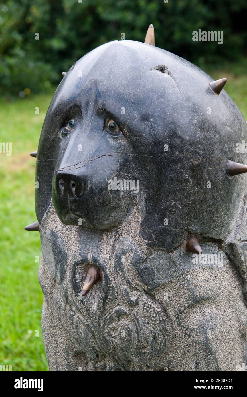 A vertical closeup shot of a dog statue in the Sculpture Park, Moscow ...