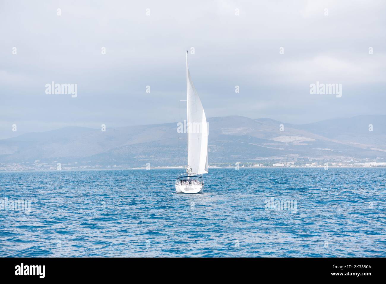 Yacht with white sails at blue sea . Wind sailing luxury boat Stock ...