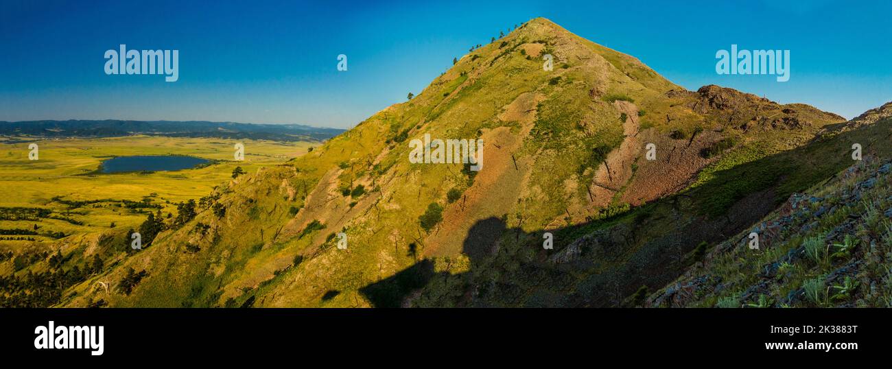 An aerial view of mountain landscape surrounded by greenery fields in ...