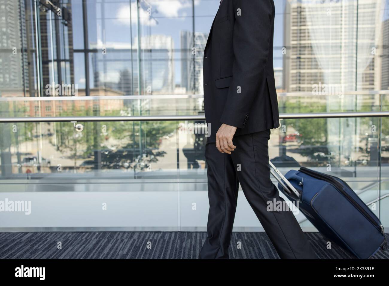 Rolling suitcase hi-res stock photography and images - Alamy