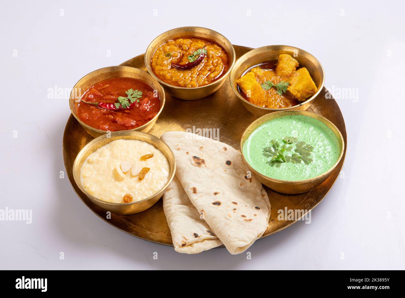 Indian Veg Thali / food platter, selective focus isolated on white ...