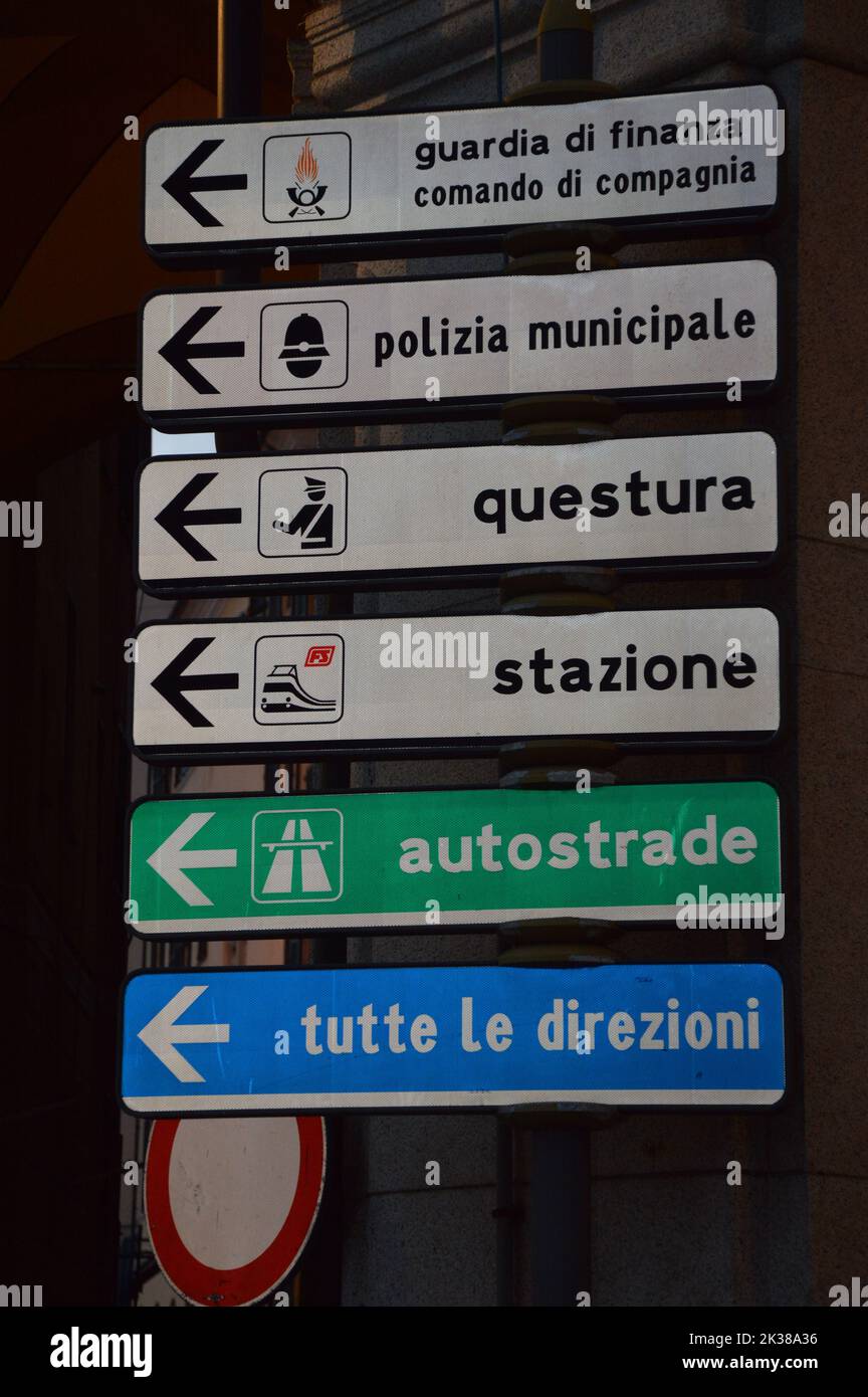 A vertical shot of road signs in Italin Stock Photo - Alamy