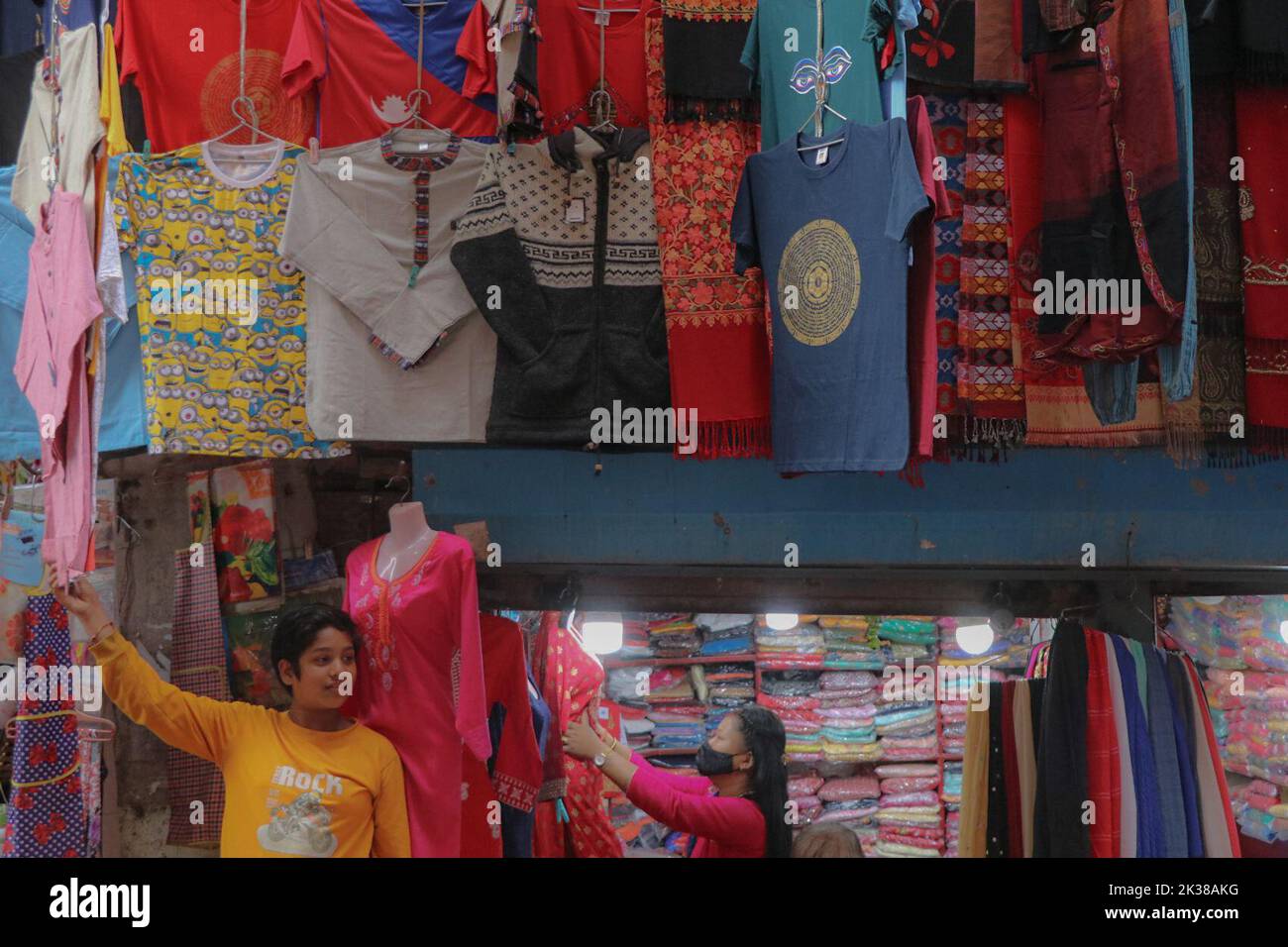 On September.25,,2022 in Kathmandu, Nepal. A boy sale clothes items ...