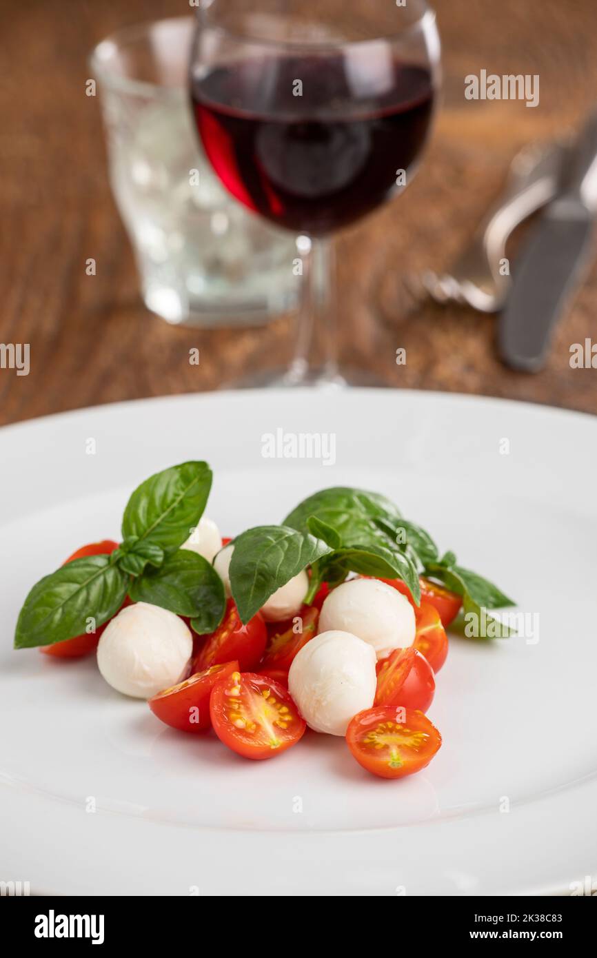 Italian insalada caprese on a white plate hi-res stock photography and ...