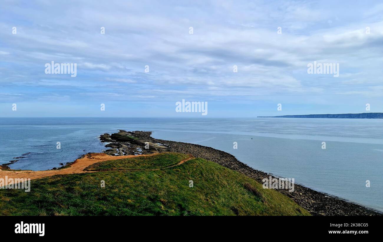 An aerial view of sea surrounded by greenery beach in Flamborough Stock ...