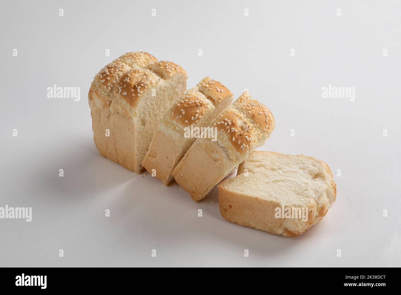 whole wheat bread slices on a white background Stock Photo - Alamy