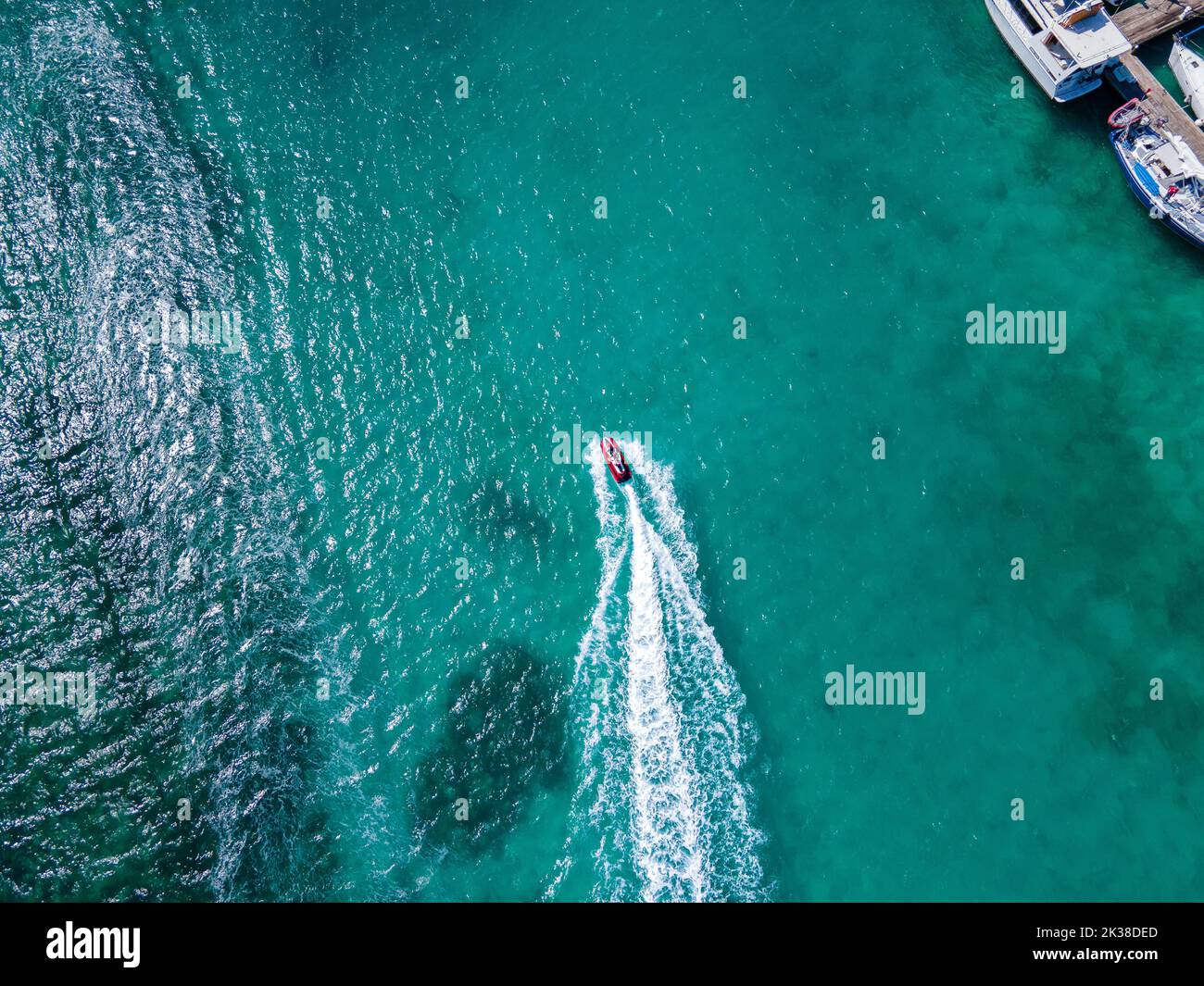 Beautiful aerial view of a wave runner in que Caribbean ocean of ...