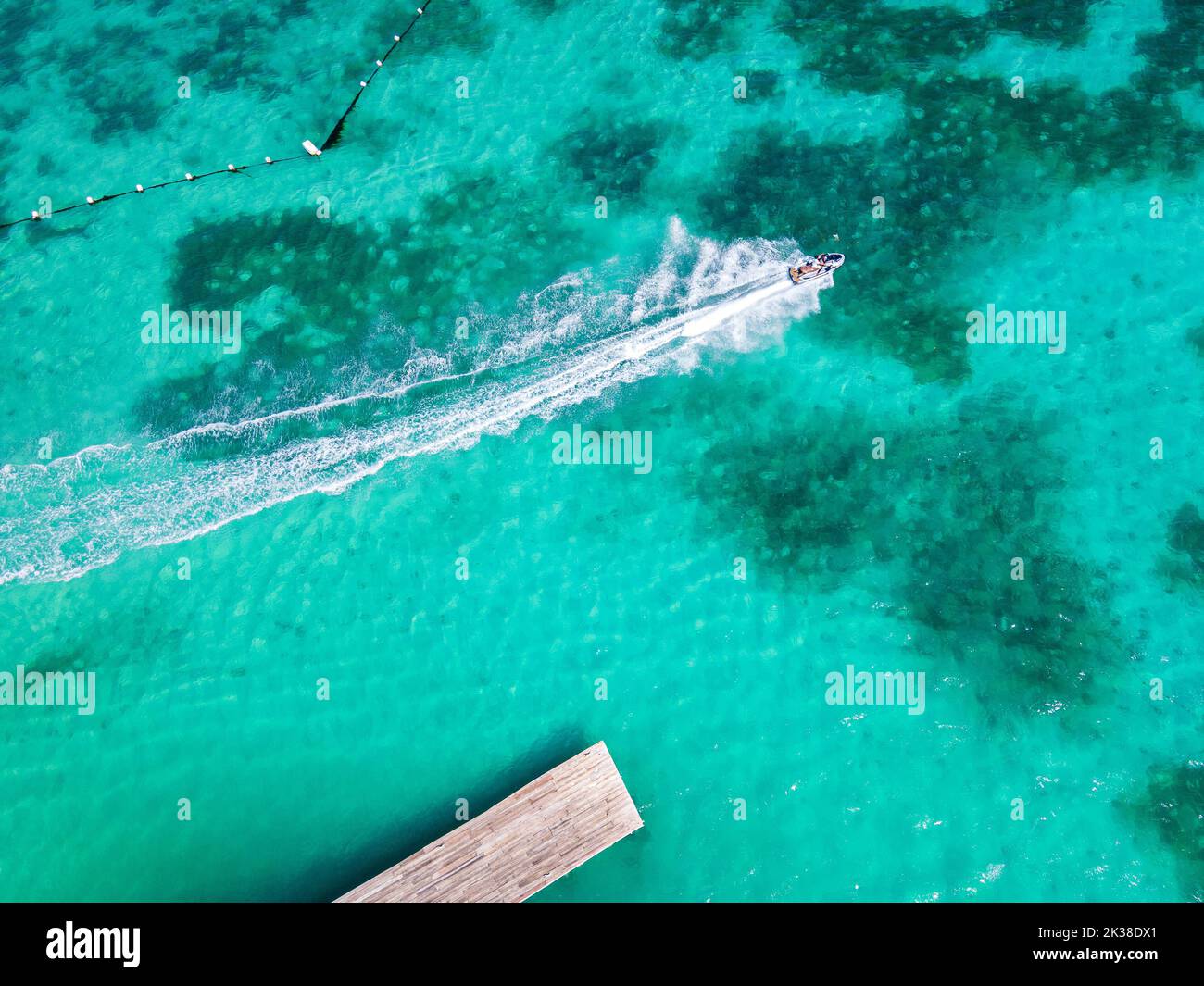 Beautiful aerial view of a wave runner in que Caribbean ocean of ...