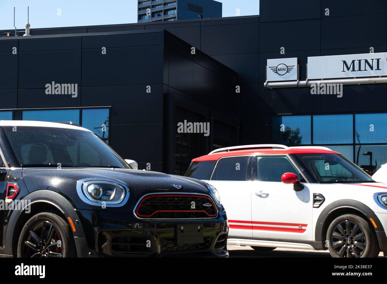 The Mini logo and sign are seen a top of a Mini dealership with new ...