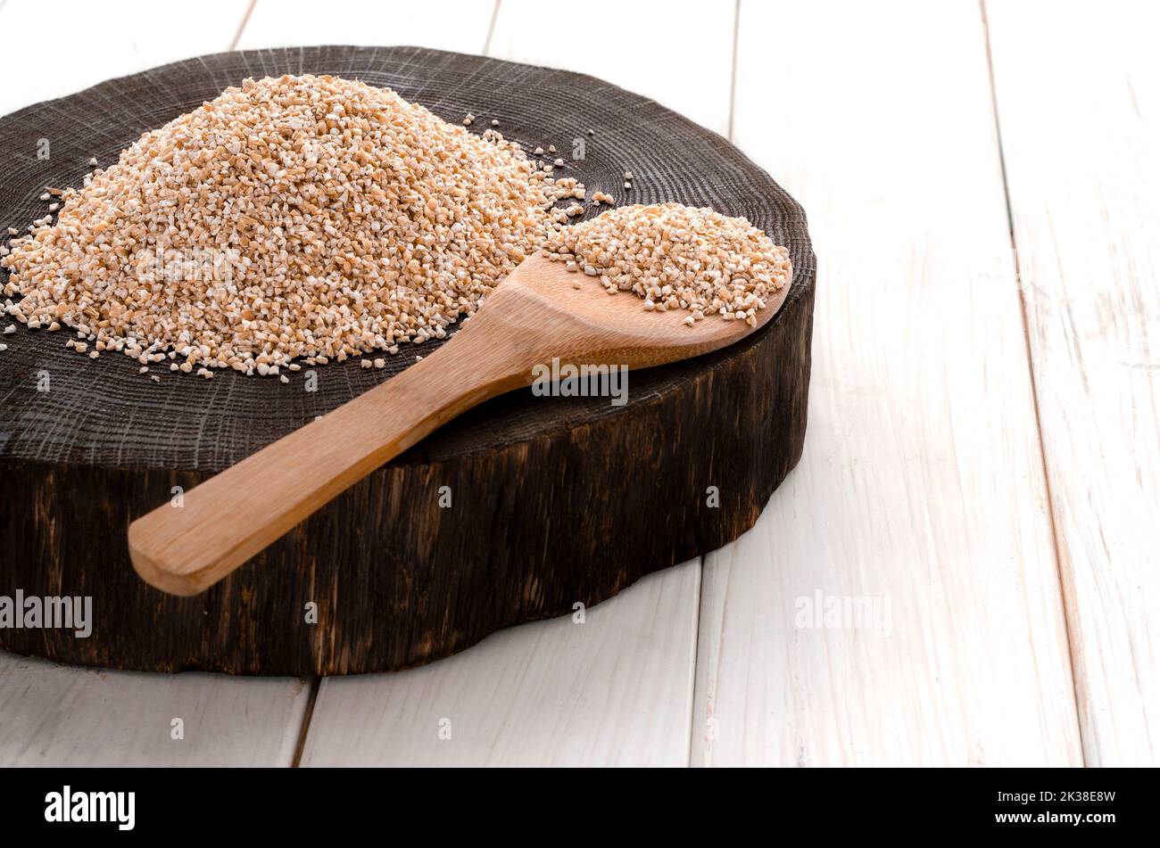 Raw dried broken barley cereal grain texture background macro closeup ...