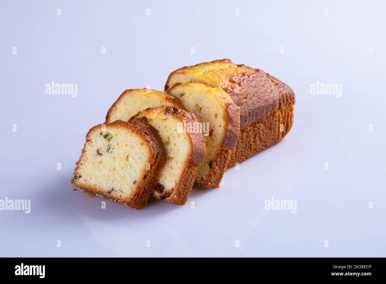 Sliced moist butter cake isolated over the white background. Pineapple ...