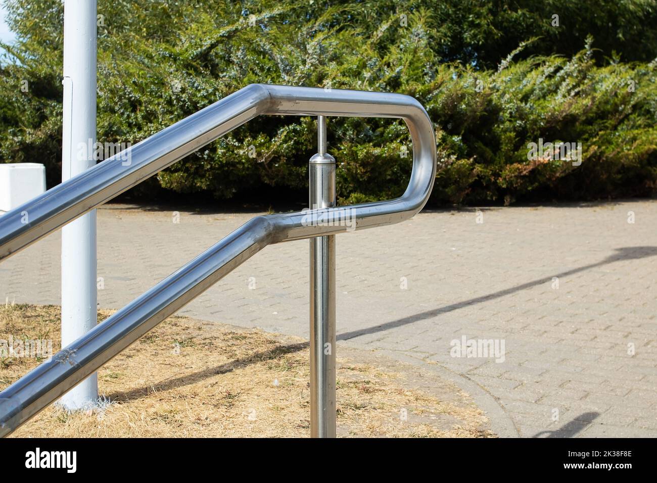 Metal railings at the stairs near the pond close up Stock Photo - Alamy